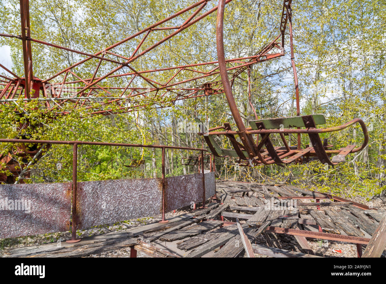 Old broken rusty metal radioactive children's electric wheel abandoned ...