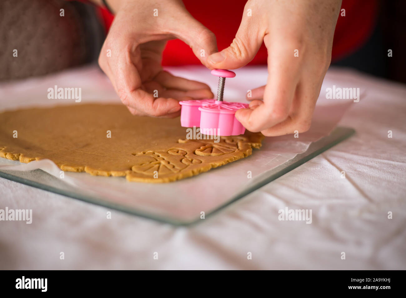 the process of making biscuits, shortbread dough raw, cut shape, sweet ...
