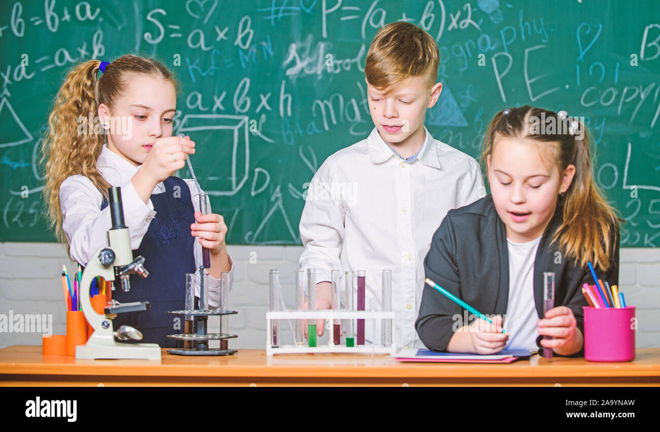 Little kids earning chemistry in school lab. biology experiments with ...