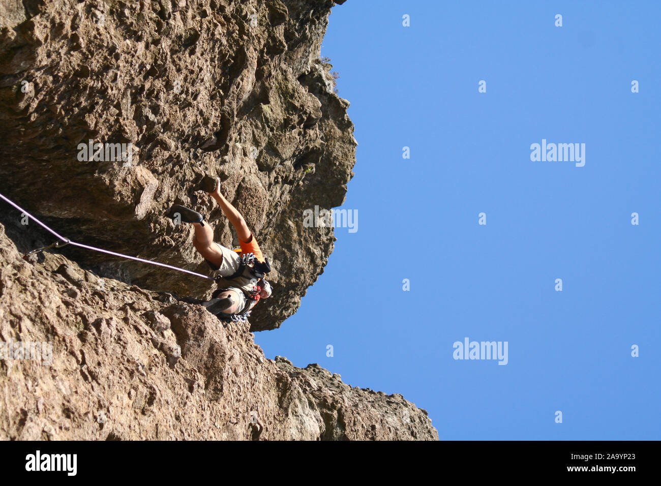 Young man rock climbing on a limestone wall Stock Photo - Alamy