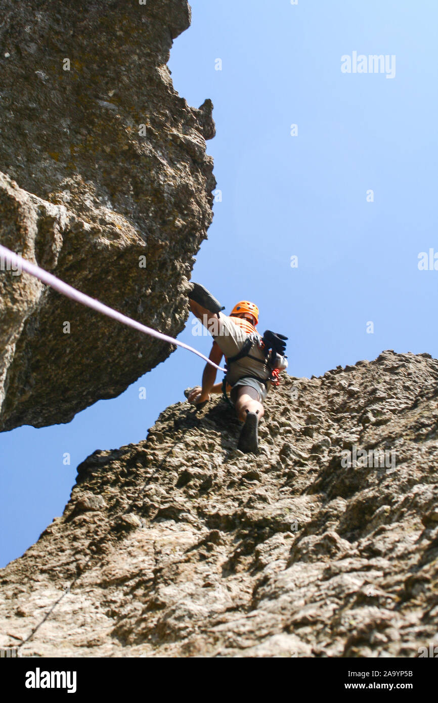 Young man rock climbing on a limestone wall Stock Photo - Alamy