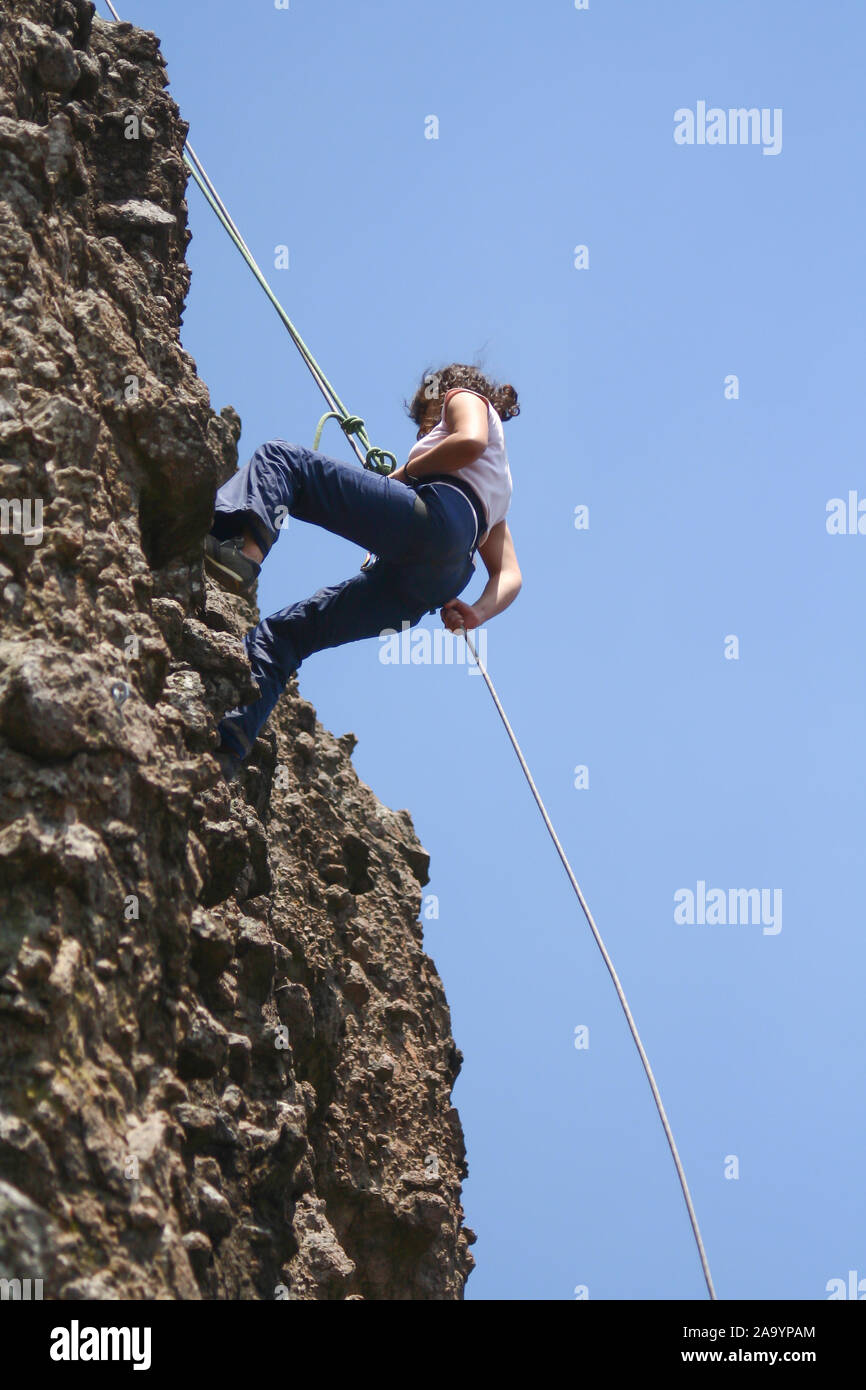Climber rappelling at a rock wall hi-res stock photography and images ...