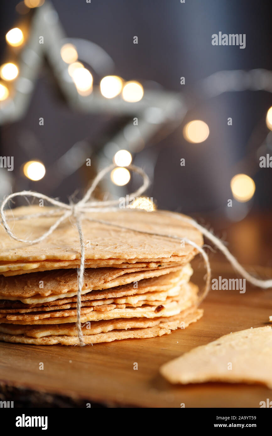 Stack of Norwegian crispy round waffles Krumkake on a tray. Concept of ...