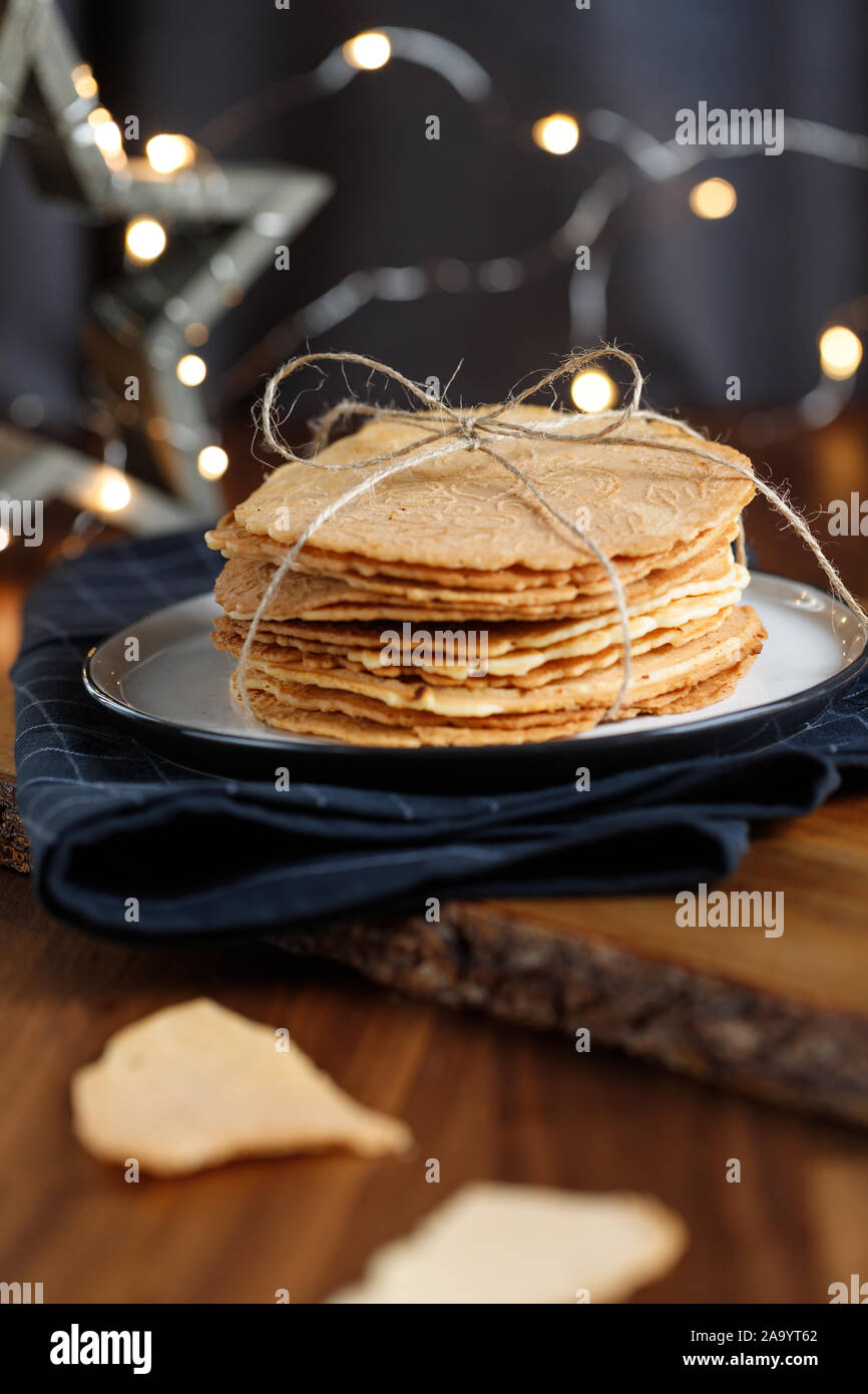 Stack of Norwegian crispy round waffles Krumkake on a tray. Concept of ...