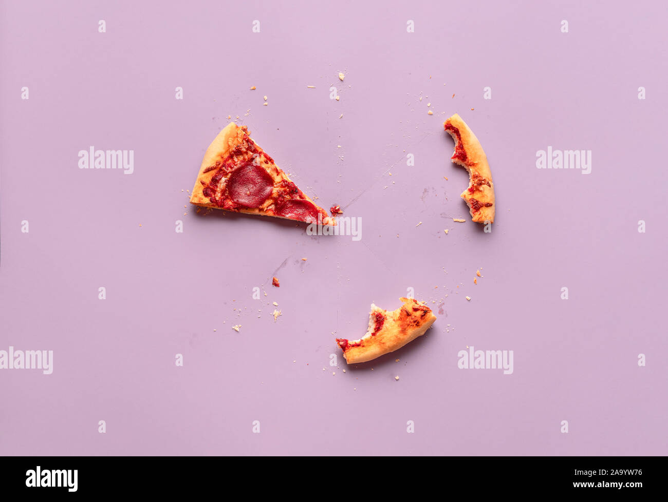 Eaten pizza concept with just one slice of salami pizza and crust ...