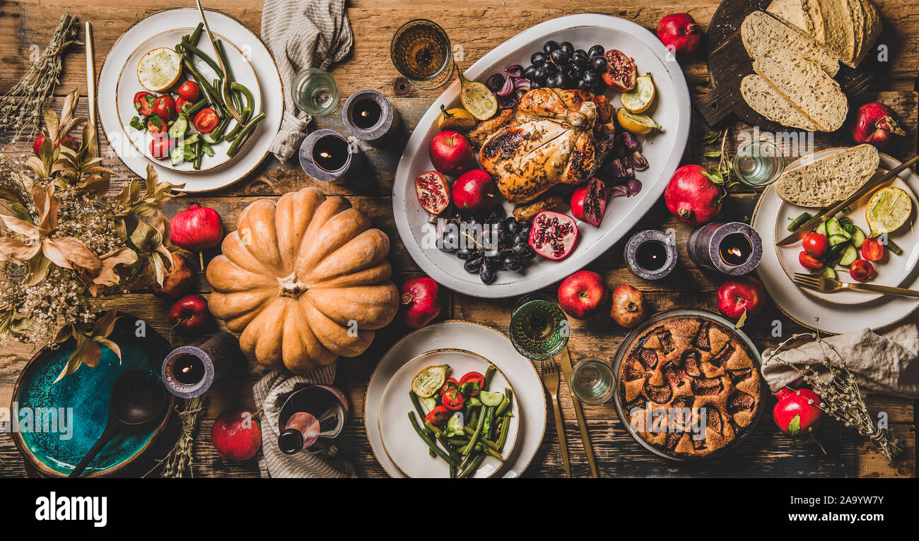 Thanksgiving party table setting with roasted chicken seasonal produce ...