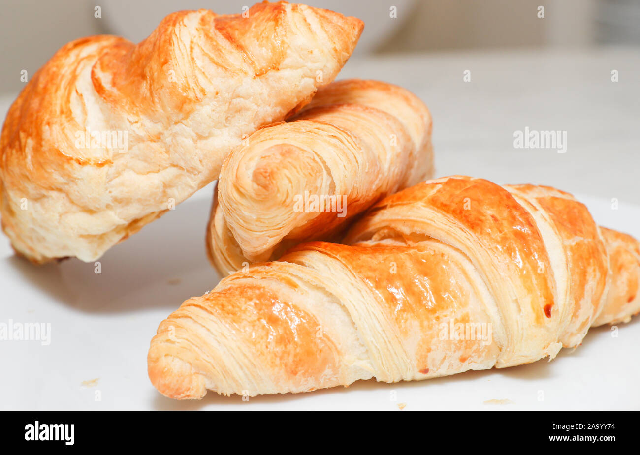 Plain croissant on white background - Image Stock Photo - Alamy