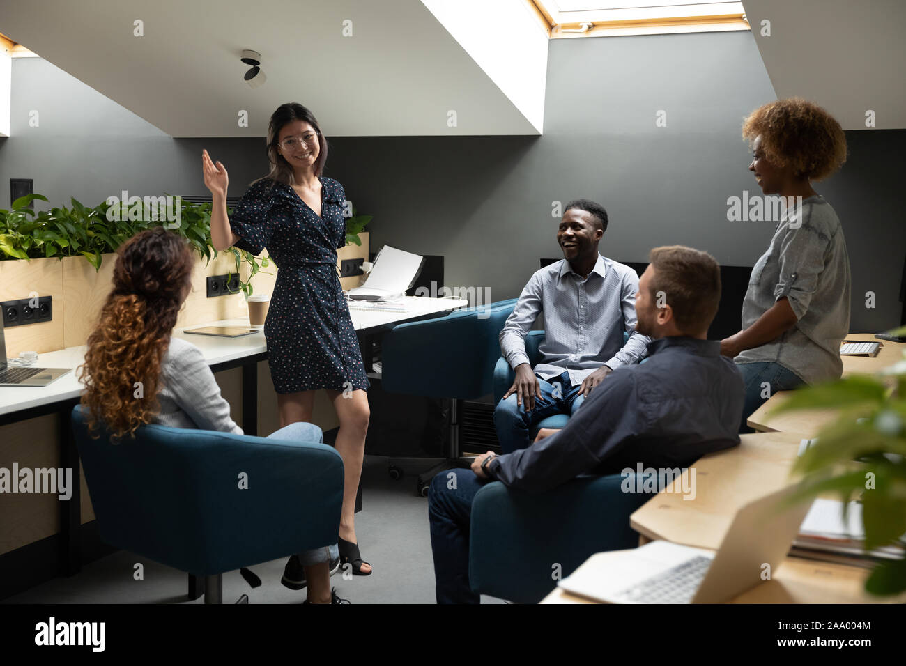 Multiracial teammates enjoying relaxed teambuilding workshop by asian ...