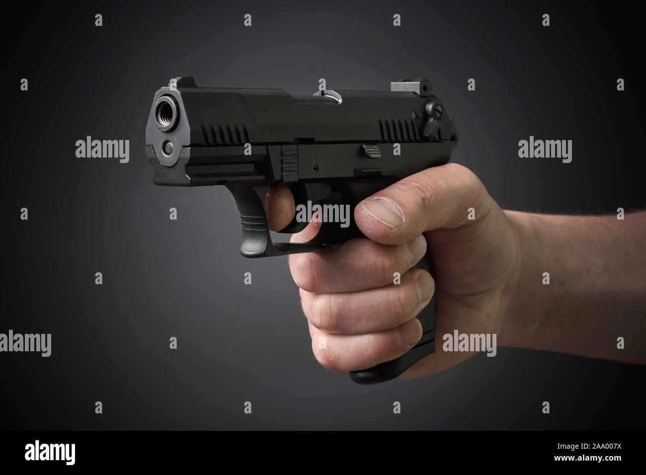 male aiming with a handgun Stock Photo - Alamy