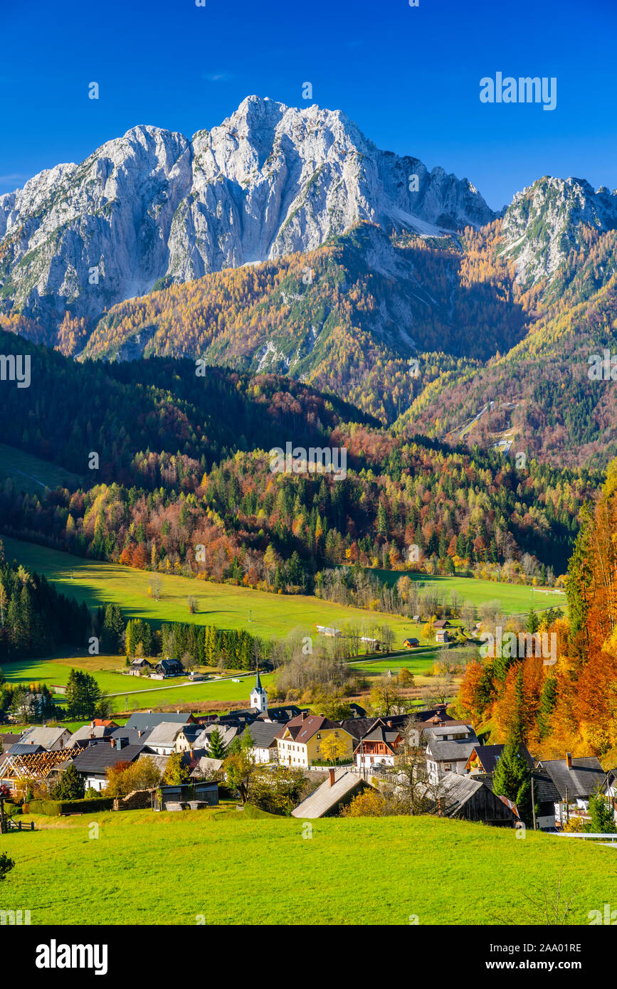 The resort town of Kranjska Gora with fall foliage color in the Julian ...