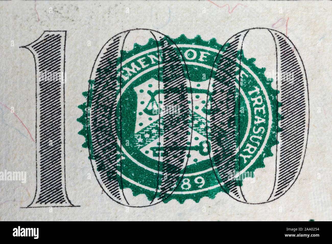 A number of one hundred on dollar bill and United States Treasury ...