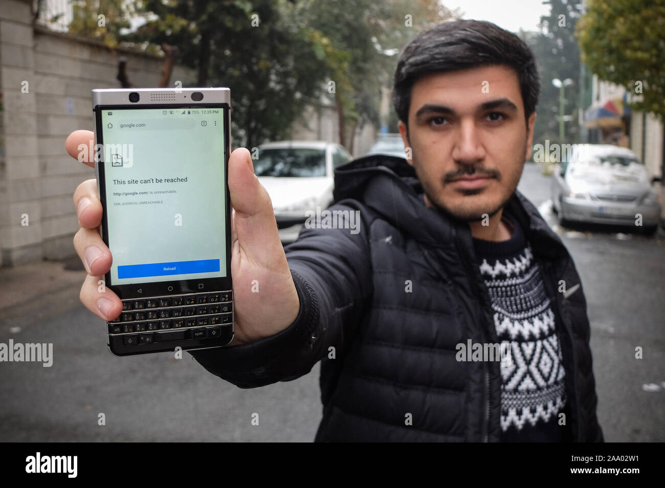 Tehran, IRAN. 18th Nov, 2019. An Iranian man shows his phone while ...