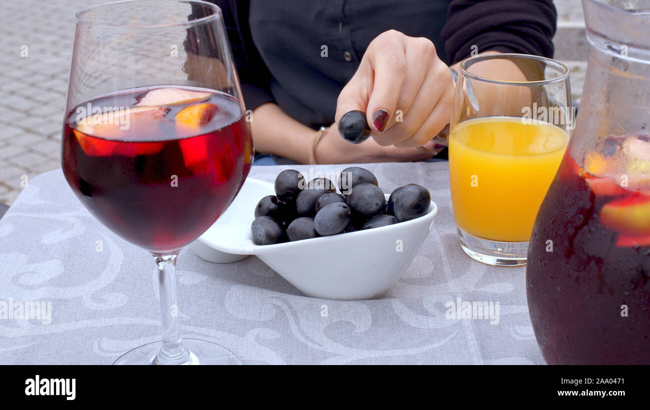 Eating fresh olives at a restaurant Stock Photo - Alamy