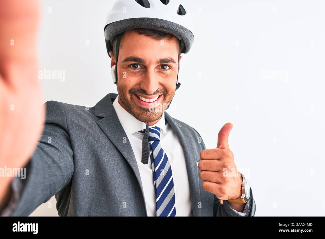 Young Handsome Business Man Wearing Bike Helmet Taking A Selfie Over