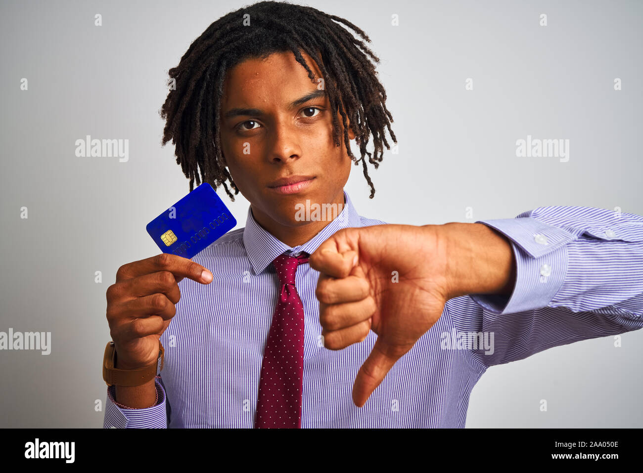 Afro american businessman with dreadlocks holding credit card over ...