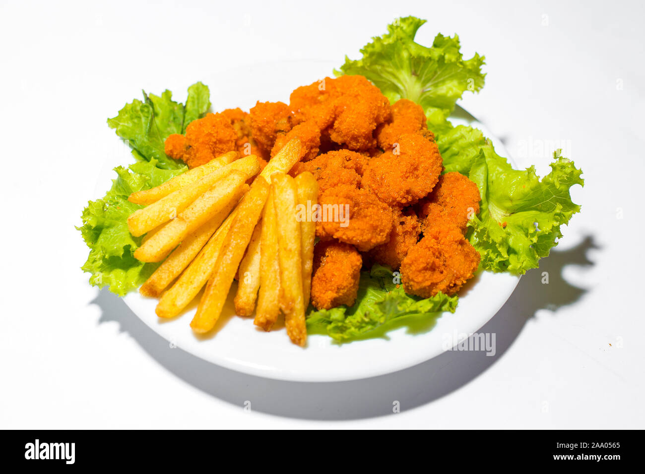 Fresh calamari with french fries in a plate. Healthy sea food squid fry ...