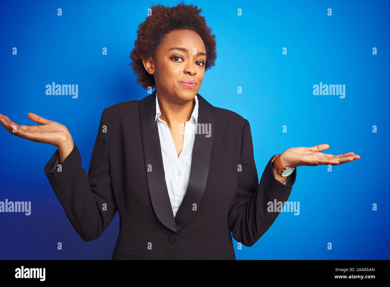 African american business executive woman over isolated blue background ...