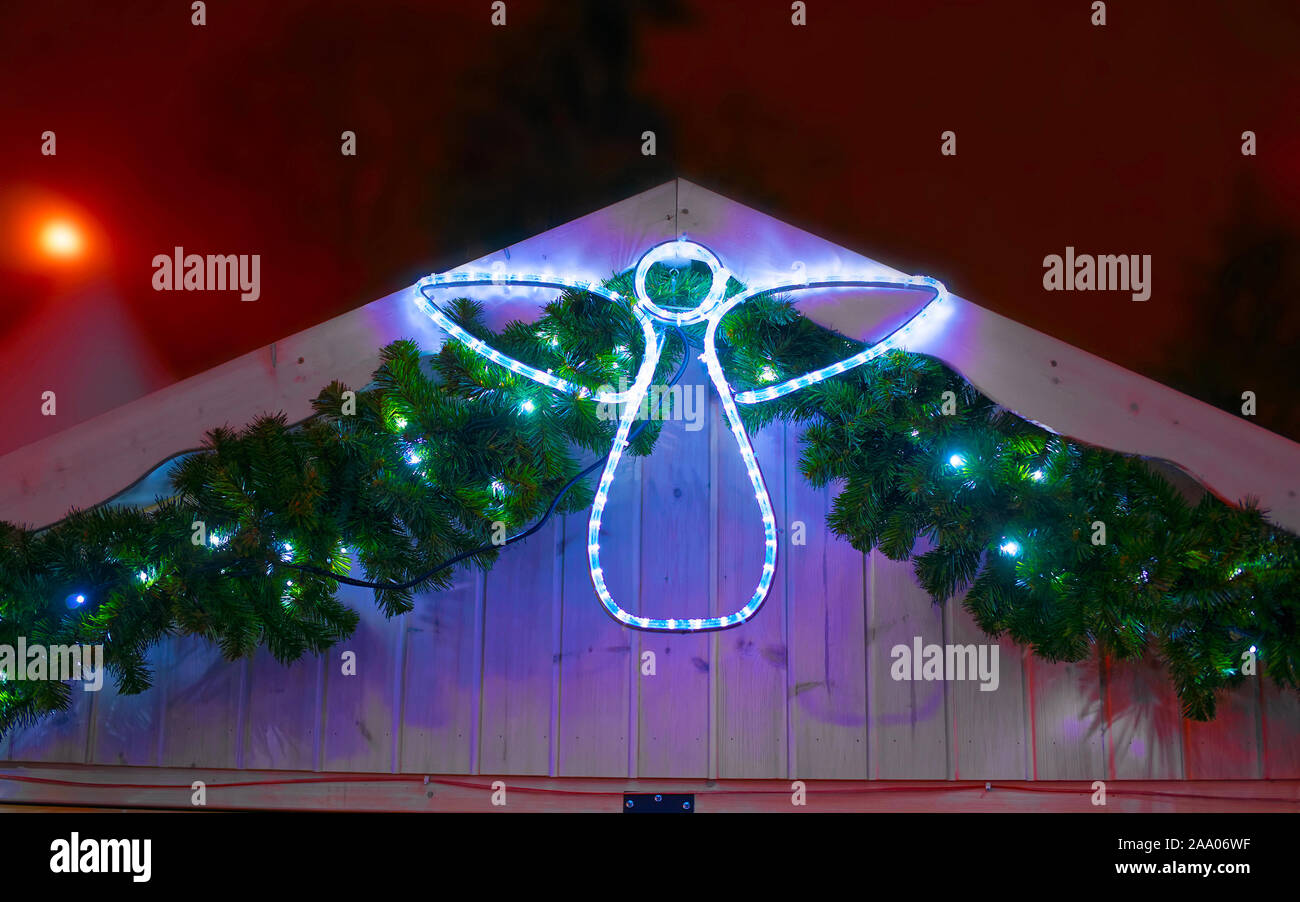 Figure of angel decorating Christmas market stall new Stock Photo - Alamy