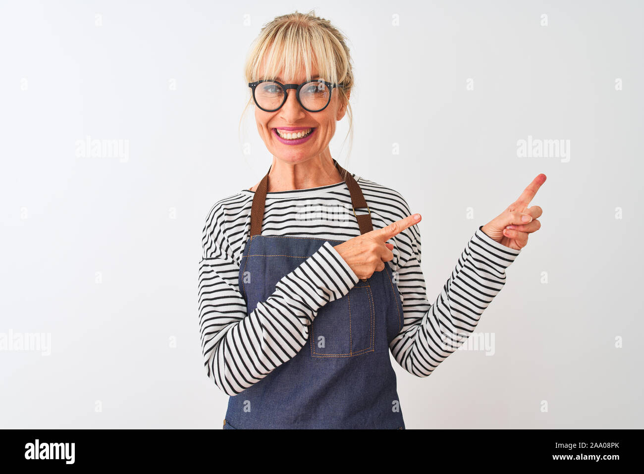 Middle age chef woman wearing apron and glasses over isolated white ...