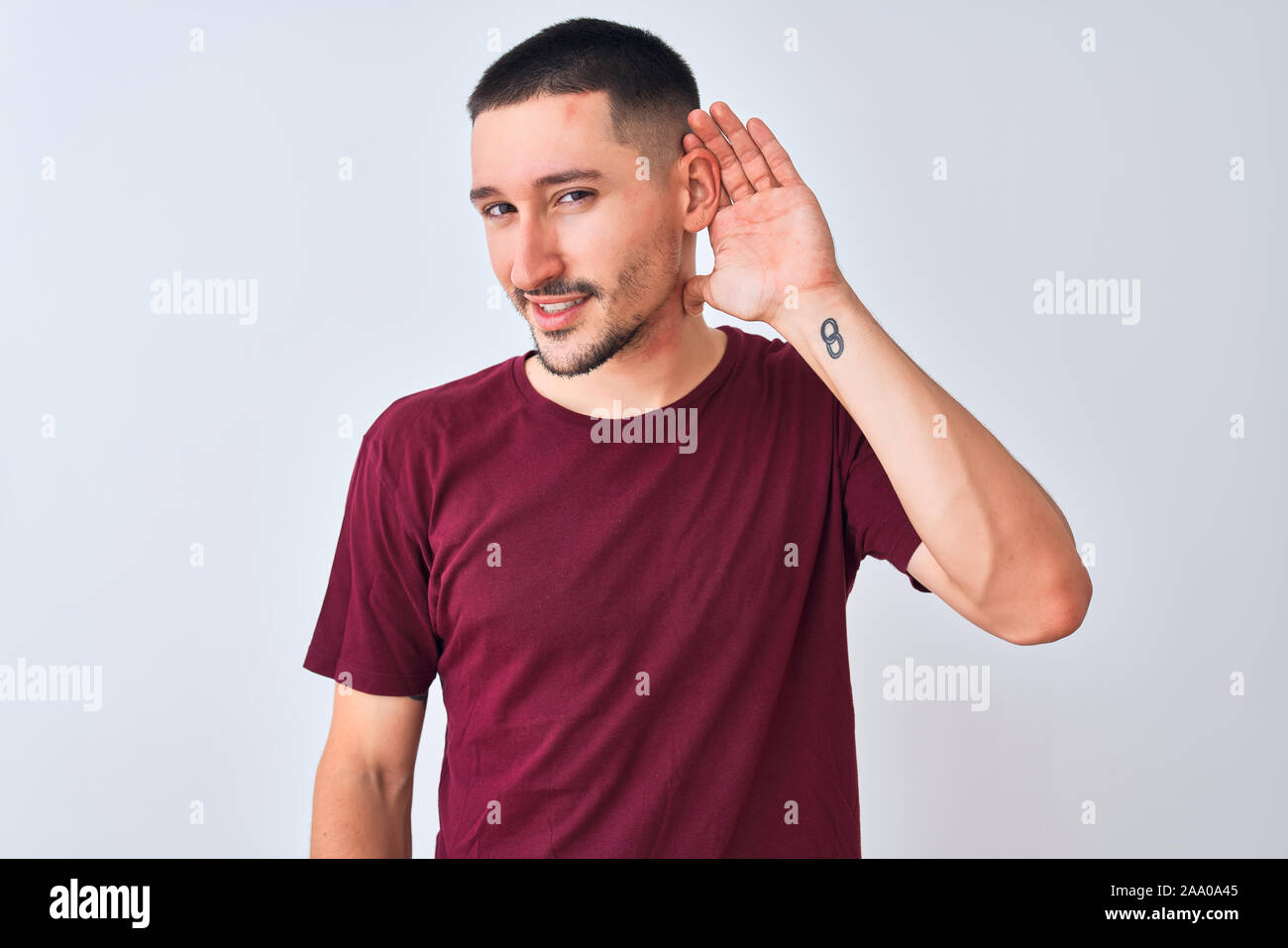 Young handsome man standing over isolated background smiling with hand ...