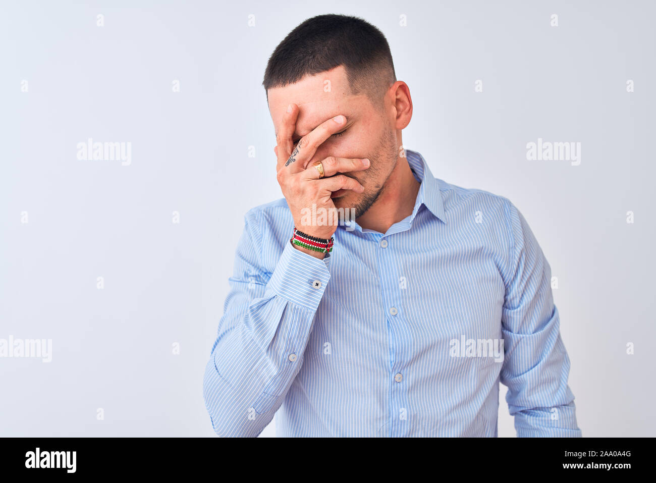 Young handsome business man standing over isolated background with sad ...