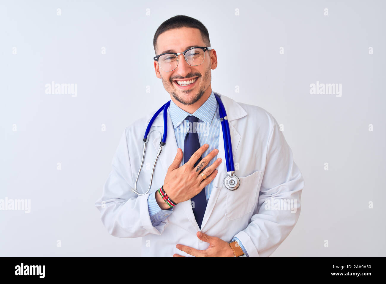 Young doctor man wearing stethoscope over isolated background smiling ...
