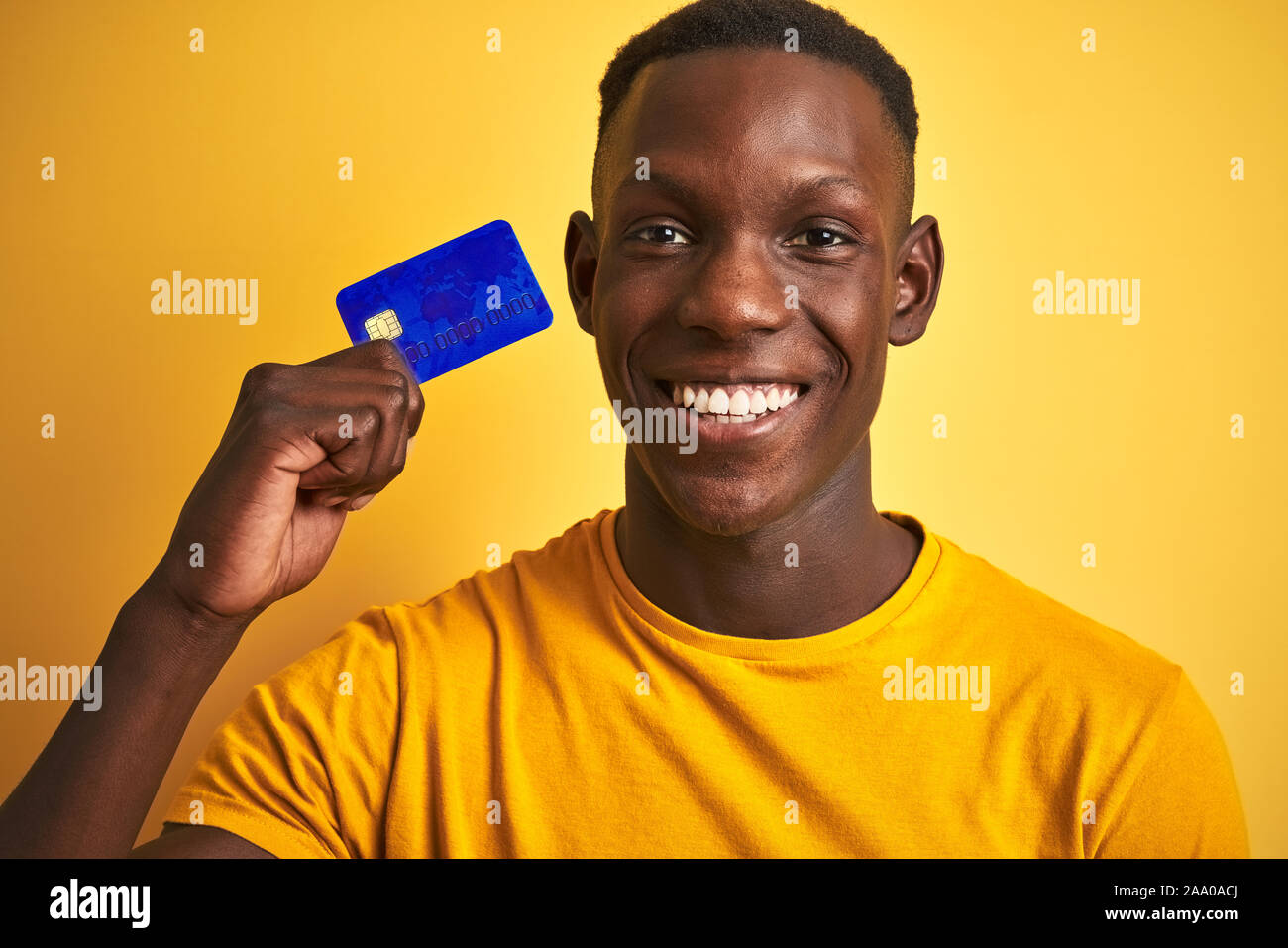 African american customer man holding credit card standing over ...