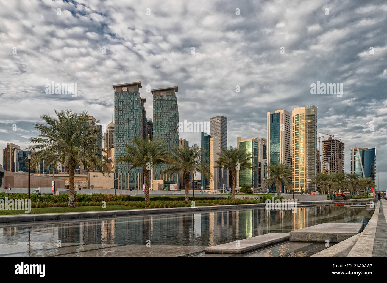 Doha, Qatar Skyline daylight view from Sheraton park with reflection in ...