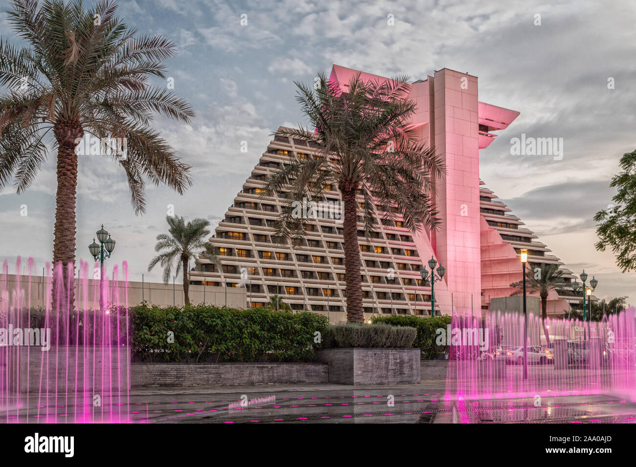 Sheraton Al Doha hotel exterior daylight view with illuminated fountain ...