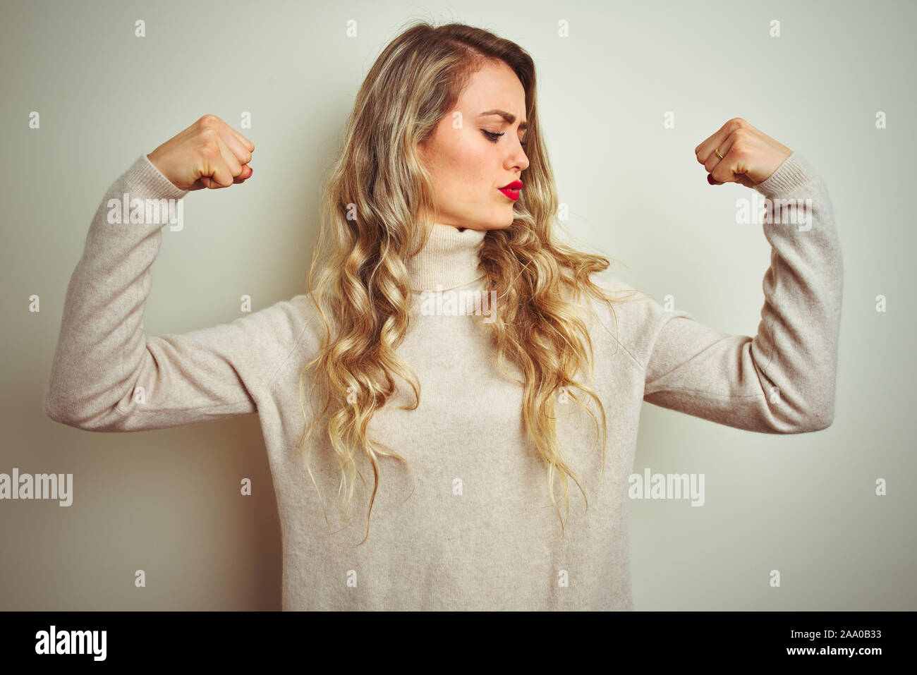 Beautiful woman wearing winter turtleneck sweater over isolated white ...