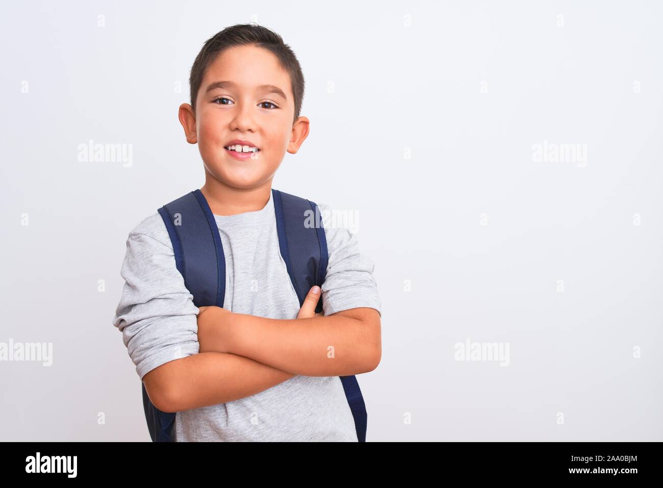 Beautiful student kid boy wearing backpack standing over isolated white ...