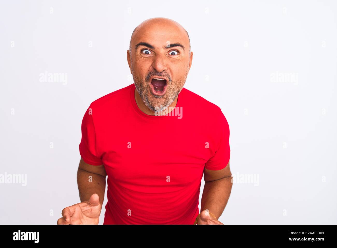 Middle age handsome man wearing red casual t-shirt standing over ...