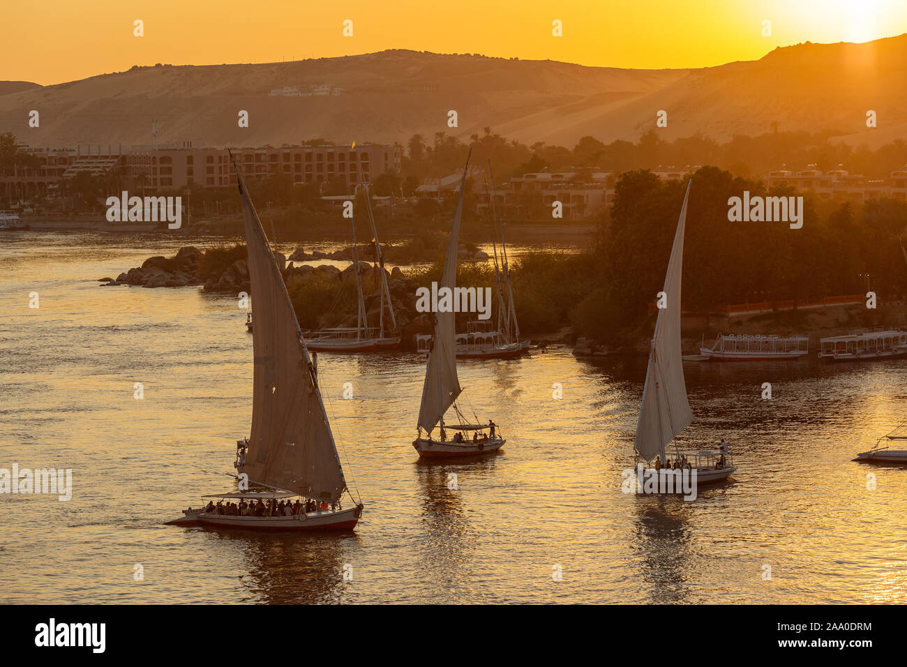 Beautiful sunset with egyptian felucca sailing by hi-res stock ...