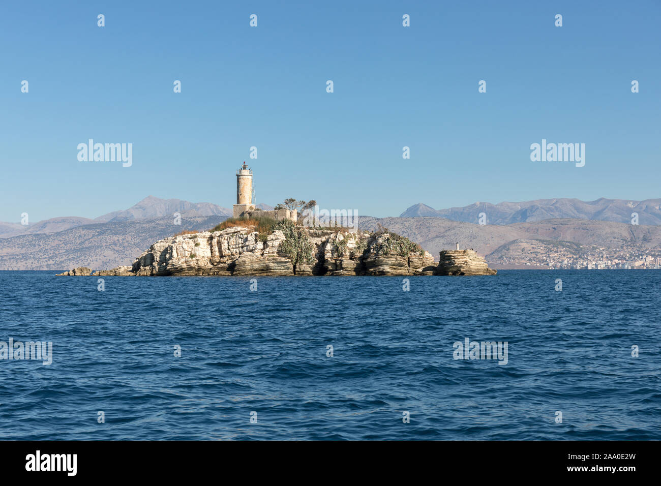 Peristeres Lighthouse, Straits of Corfu, Albanian coastline Stock Photo ...