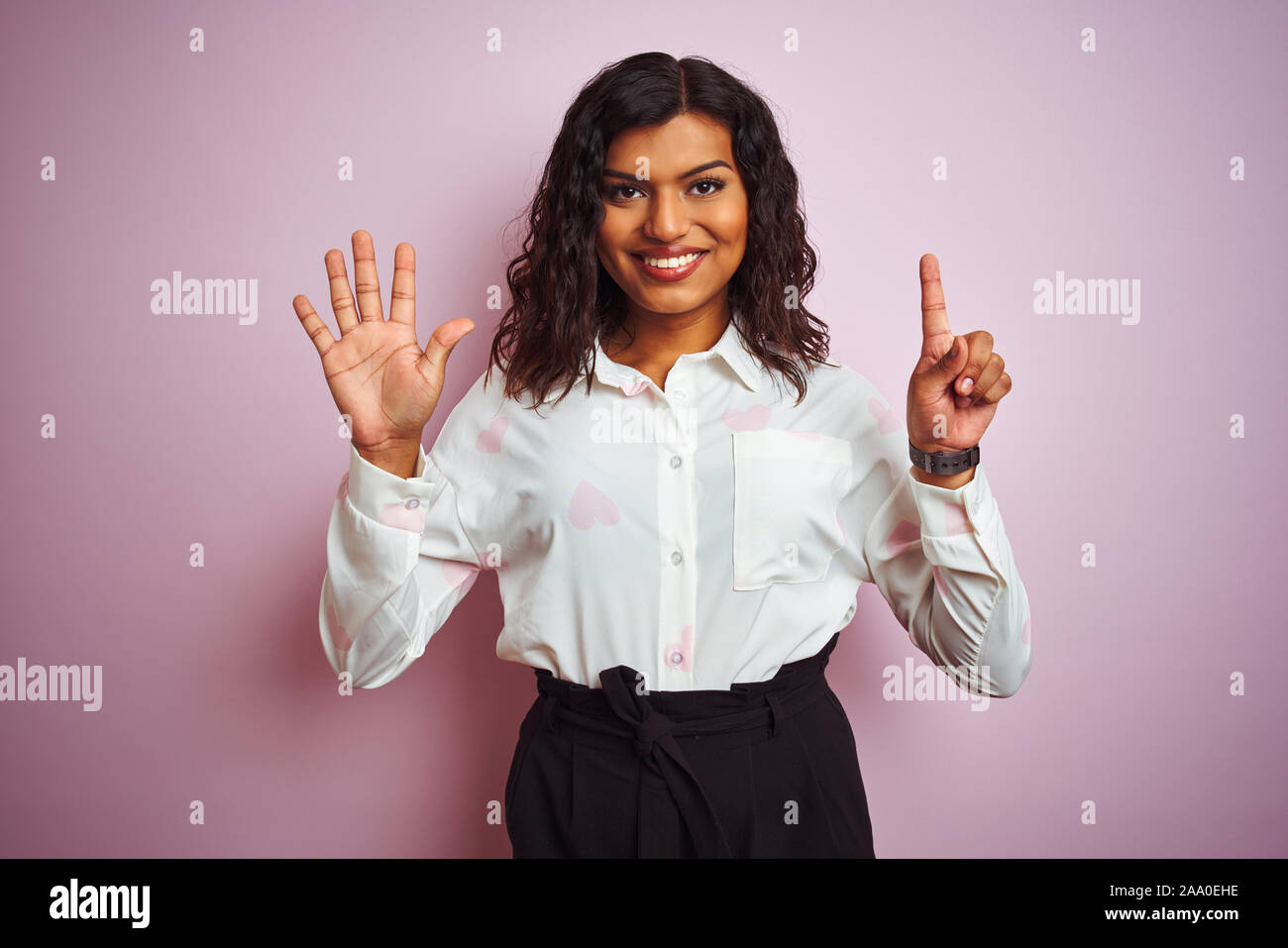 Transsexual transgender businesswoman standing over isolated pink ...