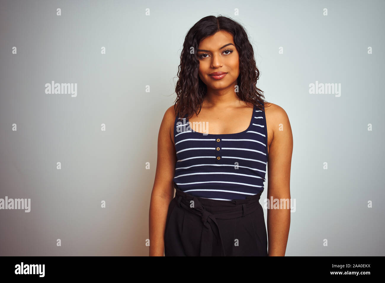 Transsexual transgender woman wearing striped t-shirt over isolated ...