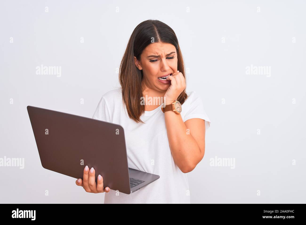 Beautiful young woman working using computer laptop over white ...