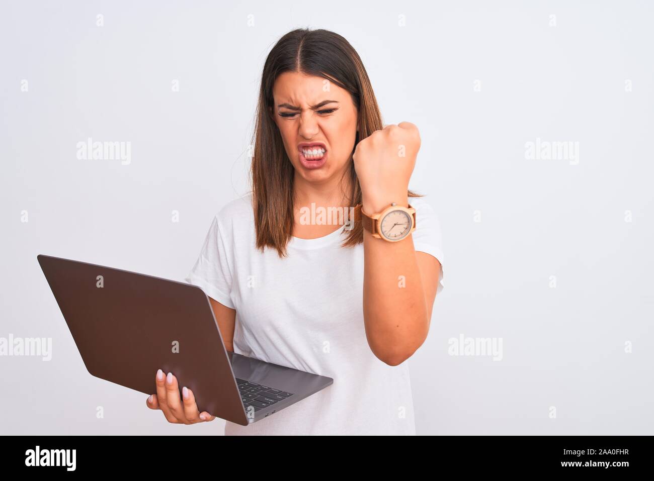 Beautiful young woman working using computer laptop over white ...