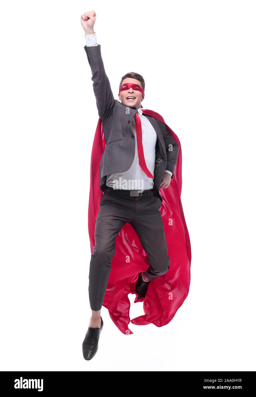in full growth. confident superhero businessman rising up Stock Photo ...