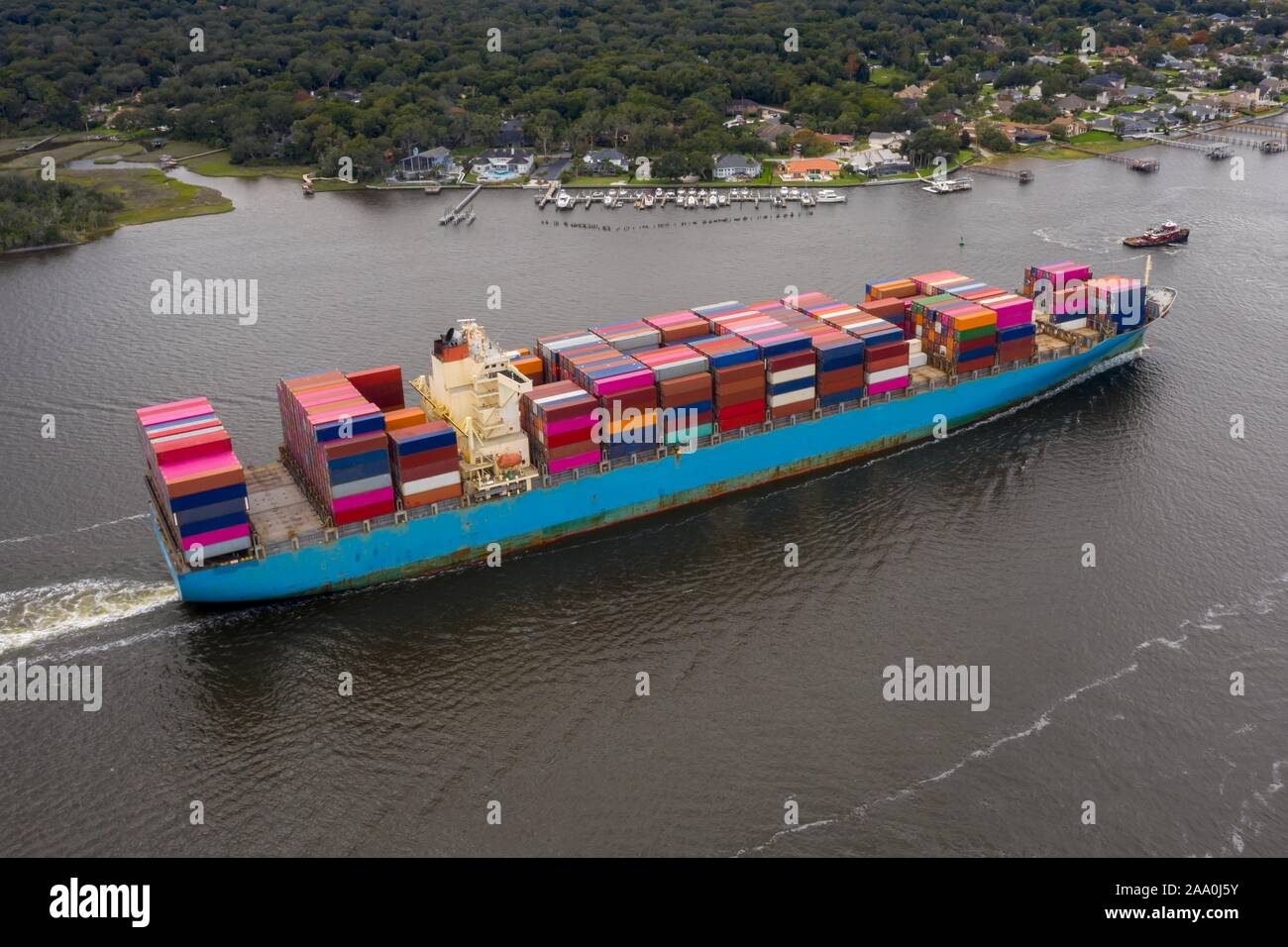 Aerial view of cargo ship entering port Stock Photo - Alamy