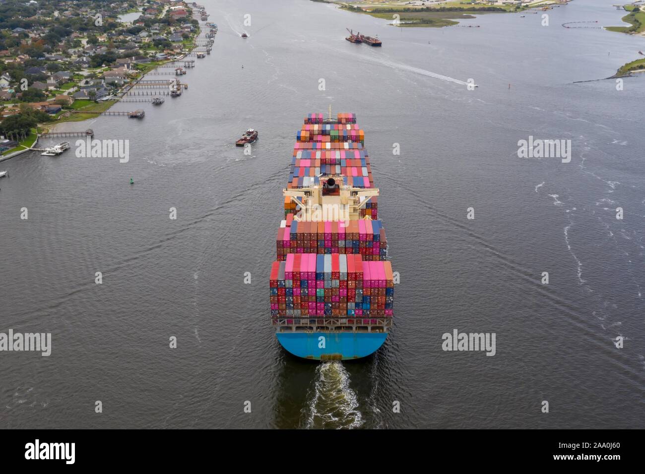 Aerial view of cargo ship entering port Stock Photo - Alamy