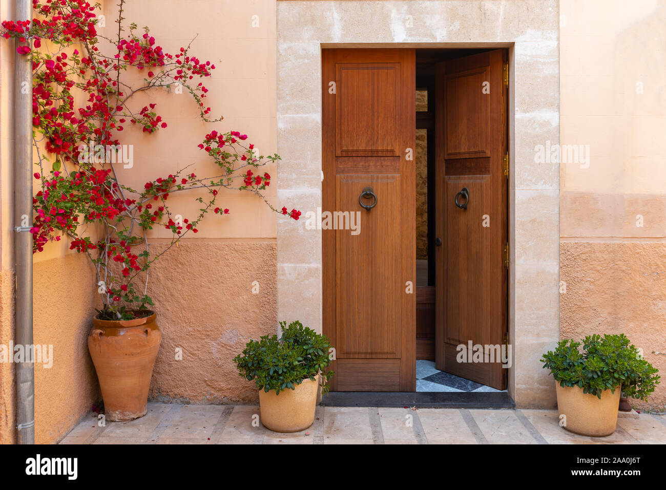 Spanish house with door and flowers on street in beautiful Old Town of ...