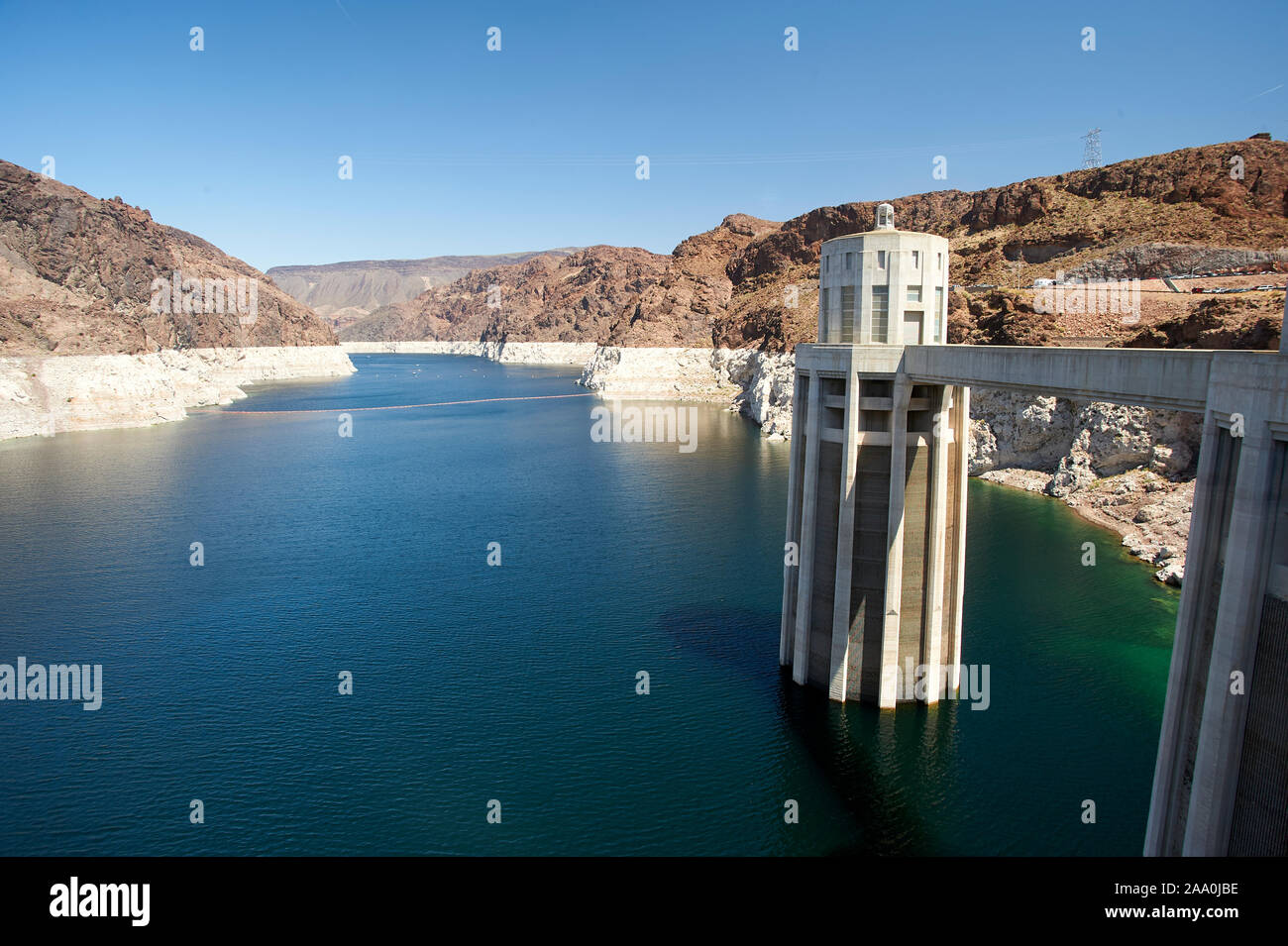 Showiing extremely low waater levels in dam from water in-flow towers ...