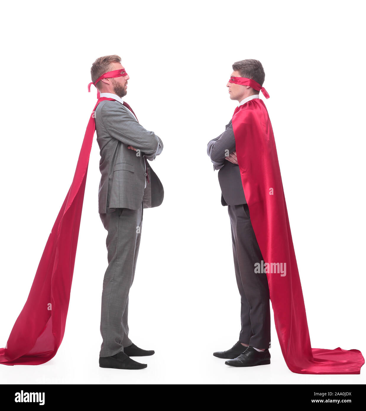 two superhero businessman looking at each other Stock Photo - Alamy