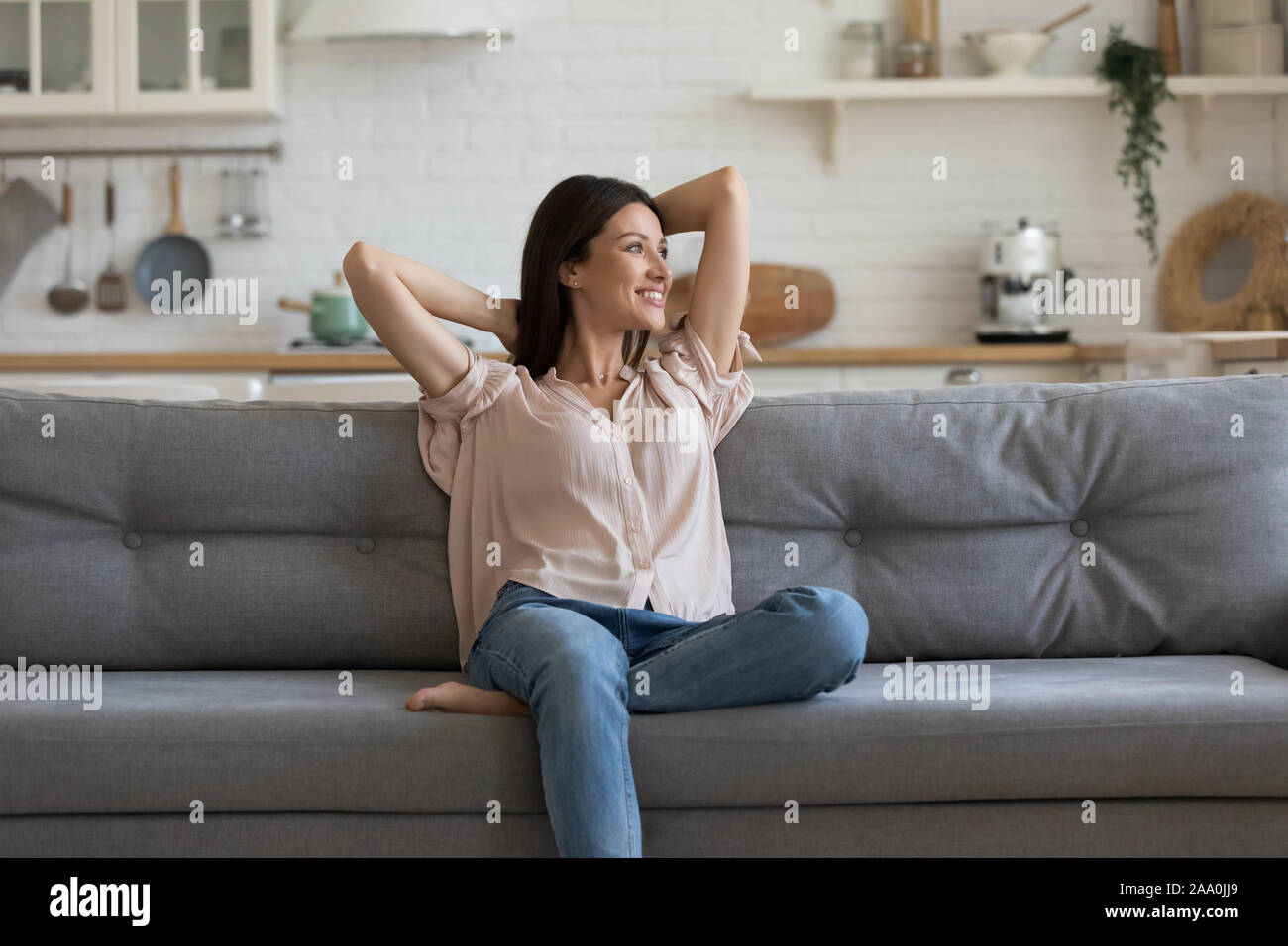 Young peaceful lady enjoying lazy weekend alone Stock Photo - Alamy