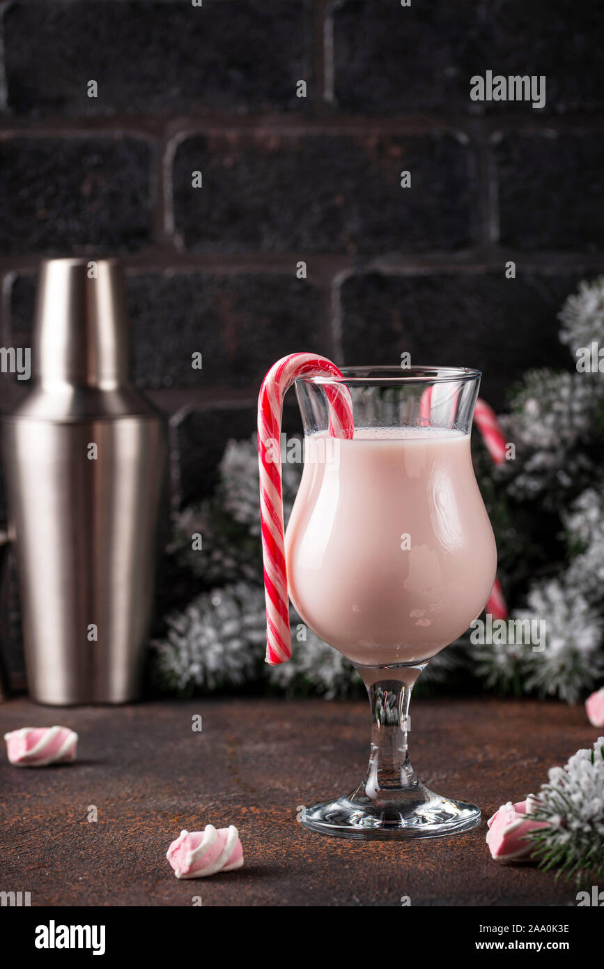 Pink Christmas cocktail with marshmallow Stock Photo - Alamy