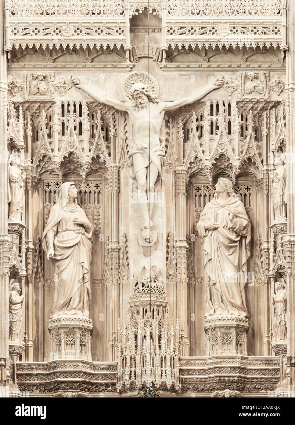 Crucifixion of Jesus Christ carved in stone on the reredos behind the ...