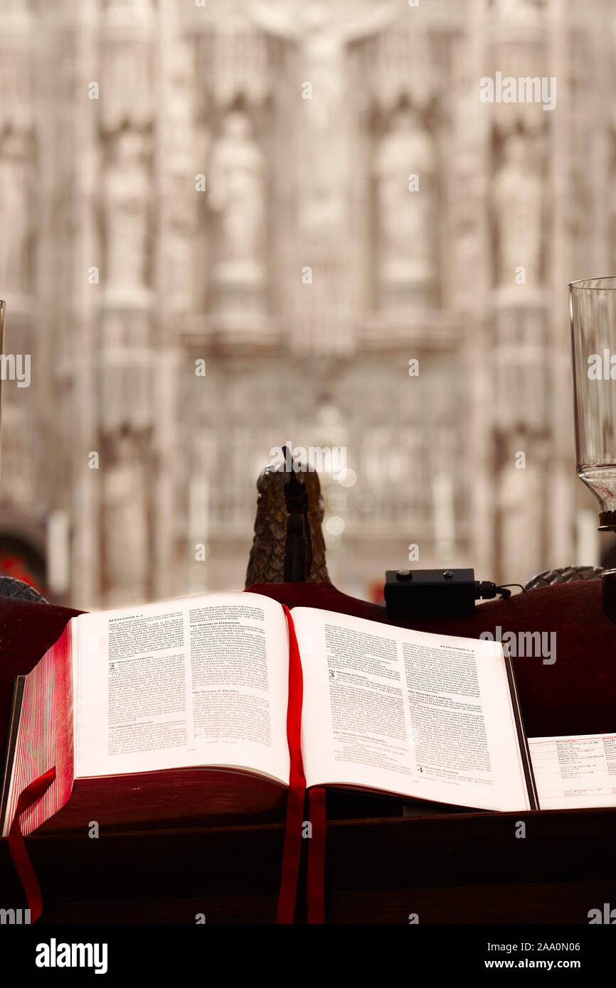 Open bible on a lectern in the choir of the english medieval cathedral ...