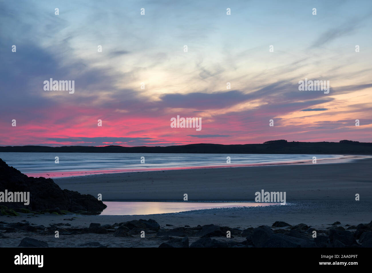 Sunset over Malltraeth Bay, Newborough Warren, Anglesey wales, UK Stock ...
