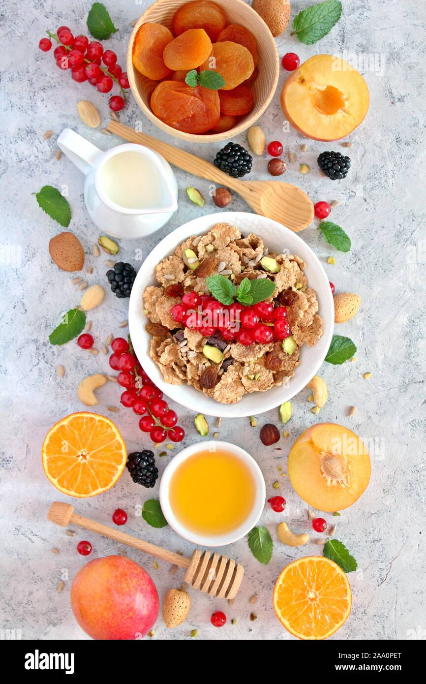 Healthy breakfast ingredients on light background. Top view with copy ...